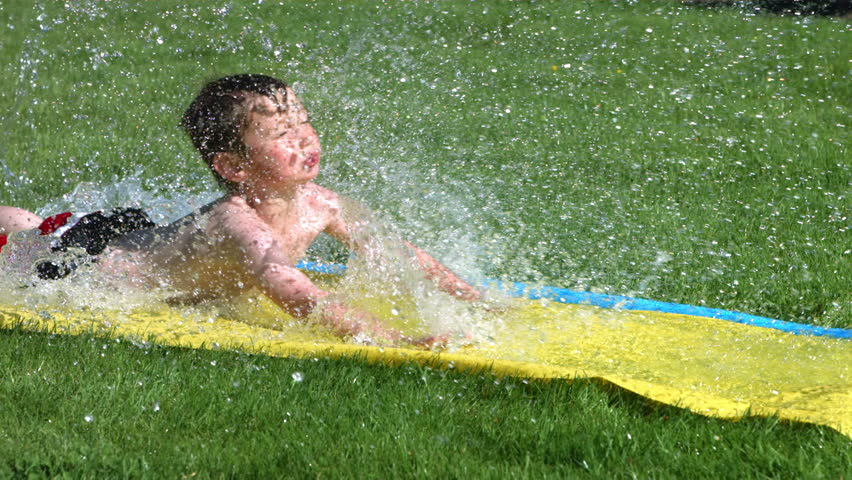 Boy On Water Slide, Slow Motion Stock Footage Video 4636394 - Shutterstock
