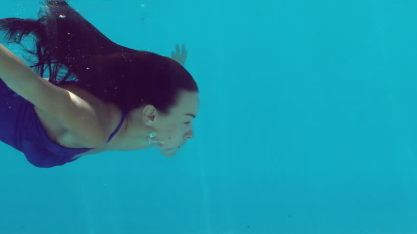 Woman In Blue Bathing Suit Swimming Underwater In Slow Motion Stock Footage Video 3996244