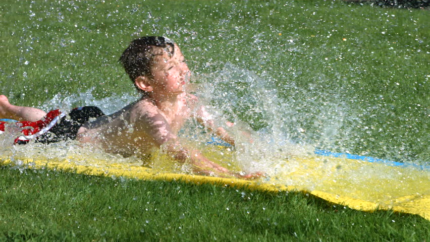 Boy On Water Slide, Slow Motion Stock Footage Video 4636394 - Shutterstock