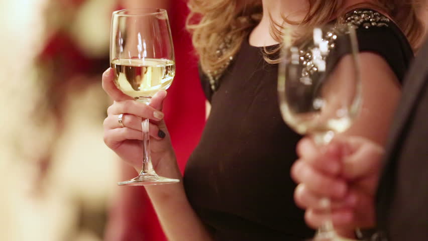 Two Girls Lesbians Are Drinking Red Wine And Are Kissing On Wallpaper Background Stock Footage