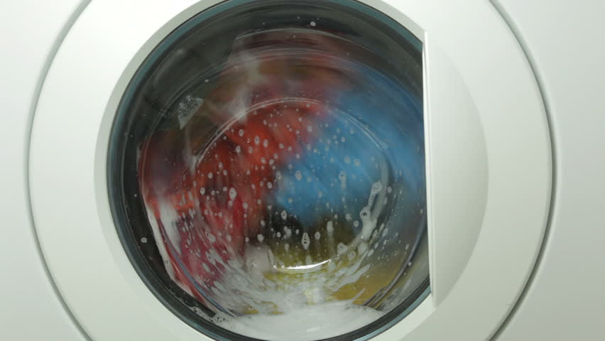 Close Up View Of Clothing Spinning In Washing Machine In Slow Motion ...