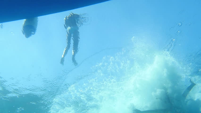 Woman In Blue Bathing Suit Swimming Underwater In Slow Motion Stock ...